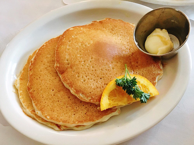 Golden-edged sourdough pancakes that make you question every other pancake relationship you've ever had. That pat of butter slowly melting is nature's perfect timer.
