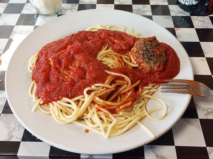 Spaghetti that would make your Italian grandmother nod in approval&mdash;a mountain of pasta swimming in sauce that's clearly been simmering since breakfast.