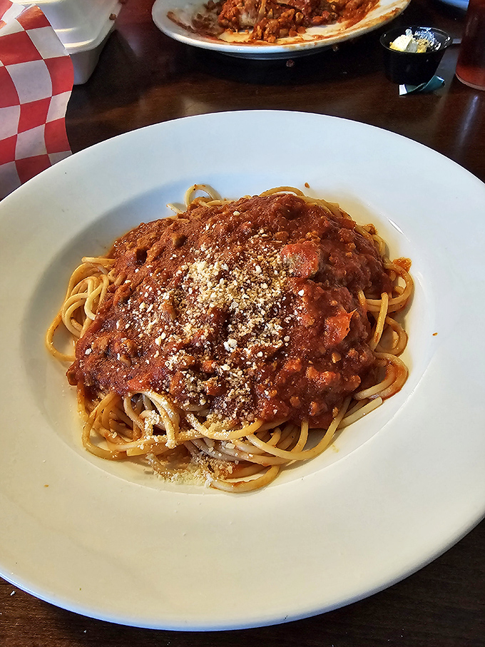 Spaghetti so perfectly coated in sauce it makes you wonder if each strand was individually dressed. That dusting of Parmesan is the snow globe finish we all dream about.