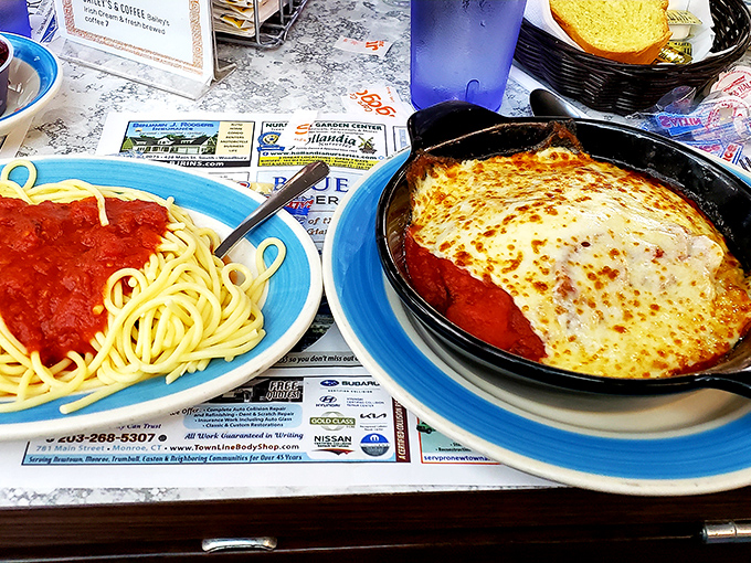 Behold the star attraction: spaghetti with marinara alongside a bubbling skillet of melted cheese that would make even an Italian grandmother nod in approval.