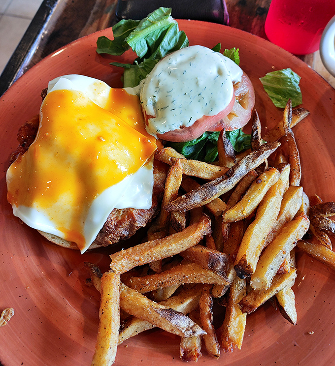 Eggs Benedict with a golden cascade of hollandaise and perfectly crisp home fries&mdash;proof that sometimes the classics need no improvement. 