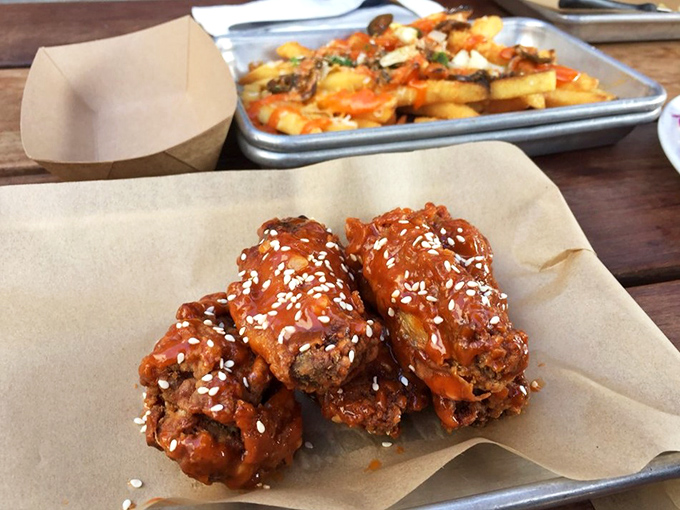 These aren't just wings &ndash; they're crispy, sesame-flecked flavor bombs that make you question your loyalty to every wing you've had before.