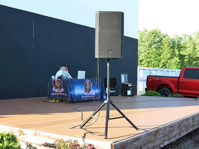 The wooden stage transforms into an open-air concert venue, proving this place knows entertainment beyond the silver screen.