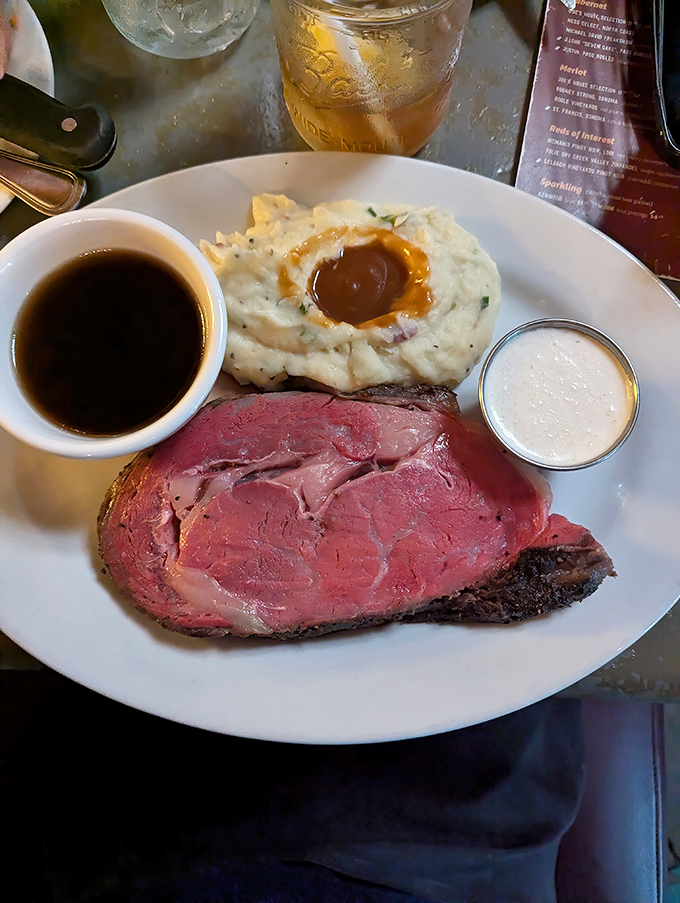This perfectly medium-rare prime rib isn't just dinner&mdash;it's a religious experience with gravy. The crater of mashed potatoes could solve California's water storage issues.