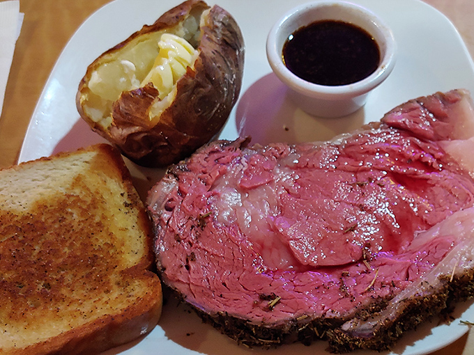 Prime rib so perfectly pink it could make a vegetarian weep. That loaded baked potato and garlic toast aren't just sides&mdash;they're supporting actors in a meaty masterpiece.