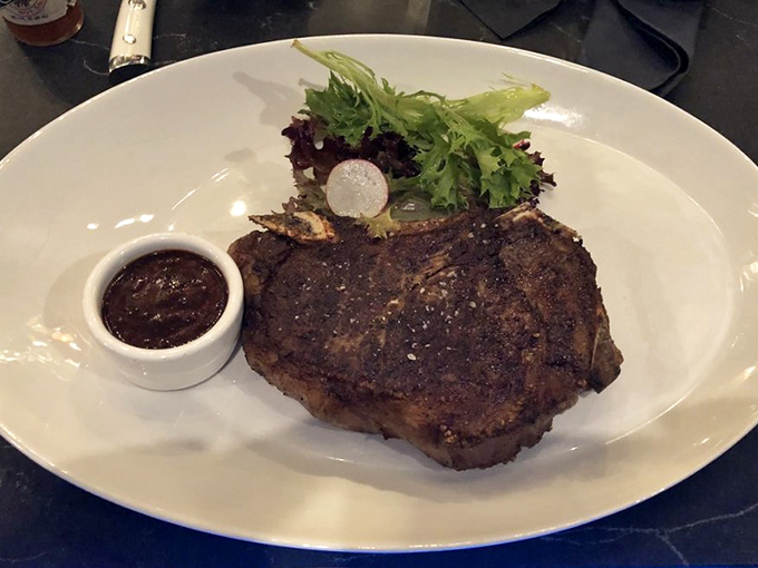 Not all heroes wear capes, but this steak wears a perfect sear. The simple garnish knows its role&mdash;supporting actor to the true star.