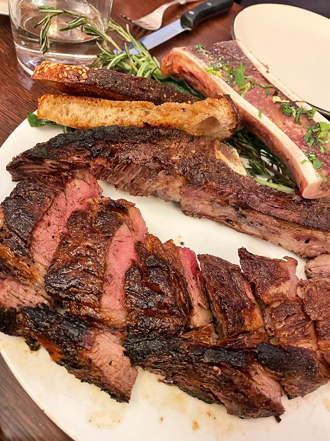 Behold the star of the show: a perfectly seared steak that makes vegetarians question their life choices. That rosy interior is what beef dreams are made of.