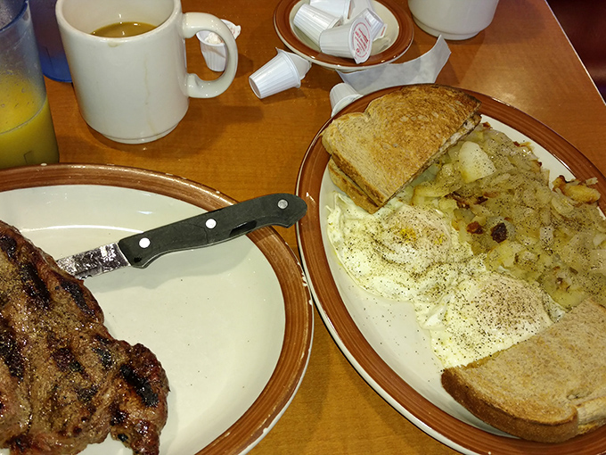 A breakfast that means business - perfectly seasoned steak alongside eggs and home fries that could make a morning person out of anyone.