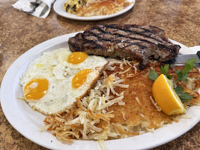 Steak and eggs: the breakfast equivalent of a power suit. Those crispy hash browns deserve their own fan club.