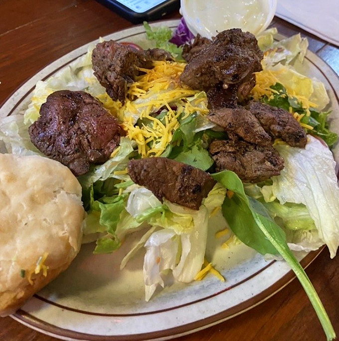 The legendary steak salad arrives like a carnivore's dream that accidentally collided with a garden&mdash;chunks of perfectly seasoned beef lounging atop crisp greens with shredded cheddar for good measure.