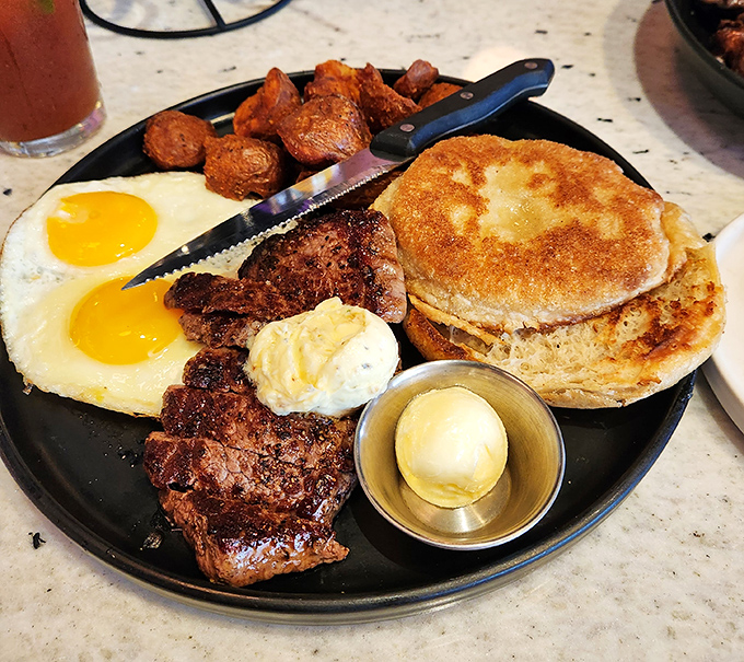Behold the headliner: steak and eggs performing their timeless duet. That butter melting on perfectly seared beef is nature's most beautiful slow dance.