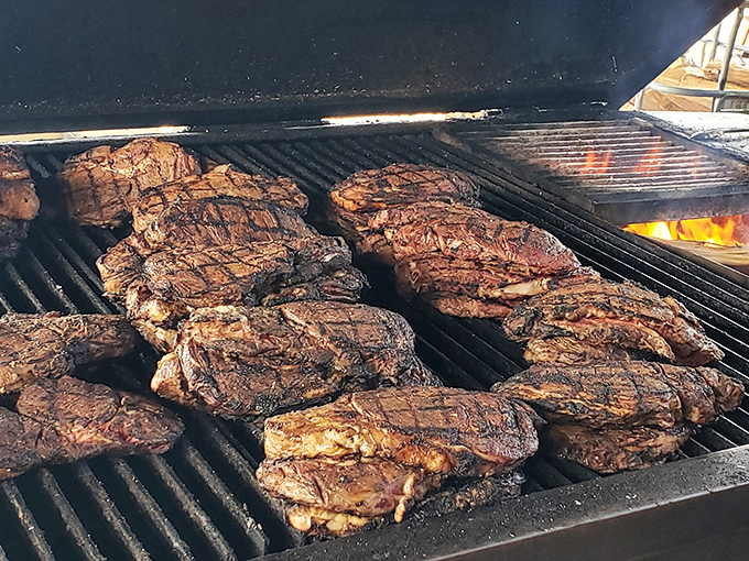 Meat candy for grown-ups! These beautifully charred steaks sizzling on the grill are about to make someone's day significantly better.