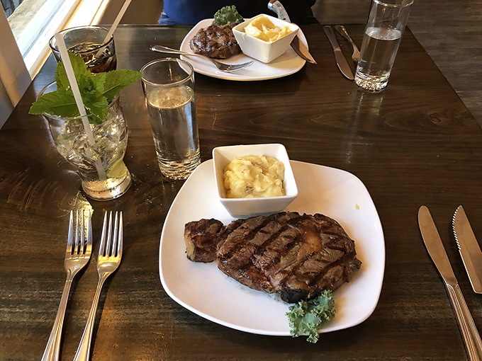 A perfectly grilled steak with a side of mac and cheese&mdash;proof that sometimes the simplest pleasures are the most profound.
