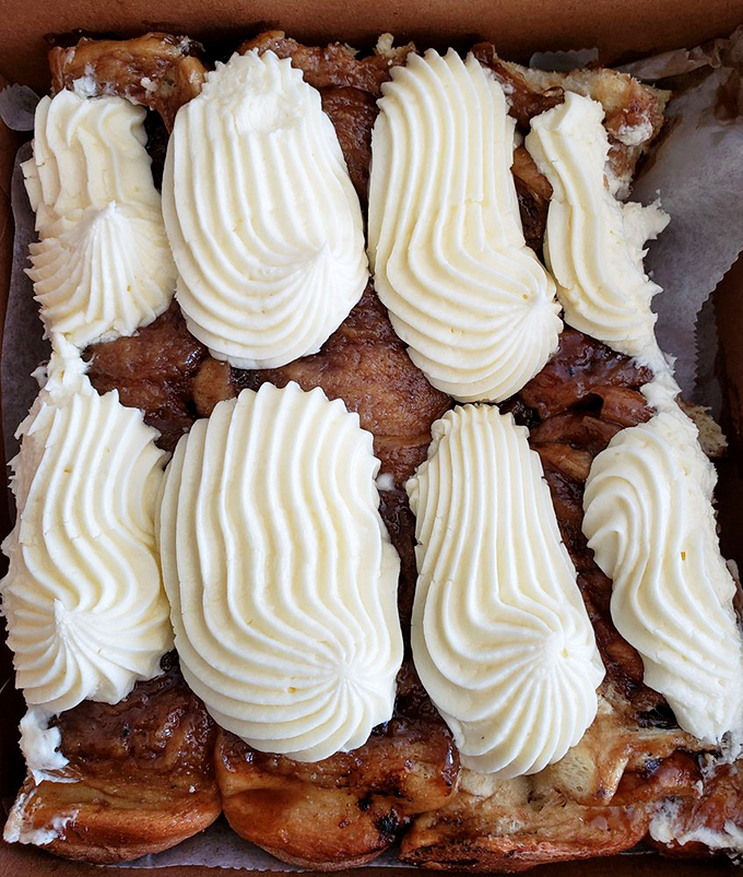 These aren't just sticky buns&mdash;they're edible architecture with perfect frosting swirls. Like Frank Lloyd Wright designed dessert with butter as the primary building material.