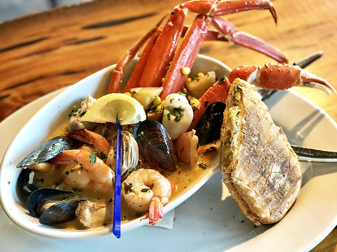 Seafood stew that could make Neptune himself jealous. Crab legs reaching skyward like they're trying to escape, but trust me&mdash;you'll want them on your fork.