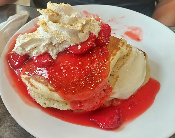 Not all heroes wear capes; some come stacked on a plate with strawberry sauce and whipped cream. These pancakes should have their own Instagram account.