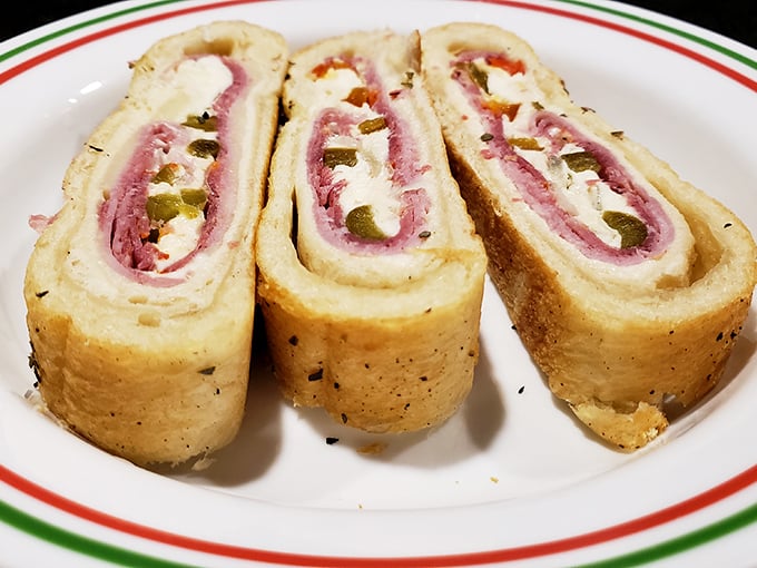 Behold the stromboli in all its glory &ndash; a perfect spiral of dough, meat, cheese, and peppers that would make even the most stoic Italian grandmother weep with joy.