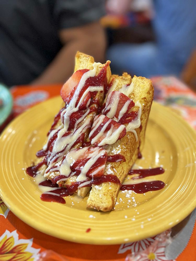 French toast that's dressed better than most people at the Oscars, drizzled with sweet sauces that make maple syrup jealous.