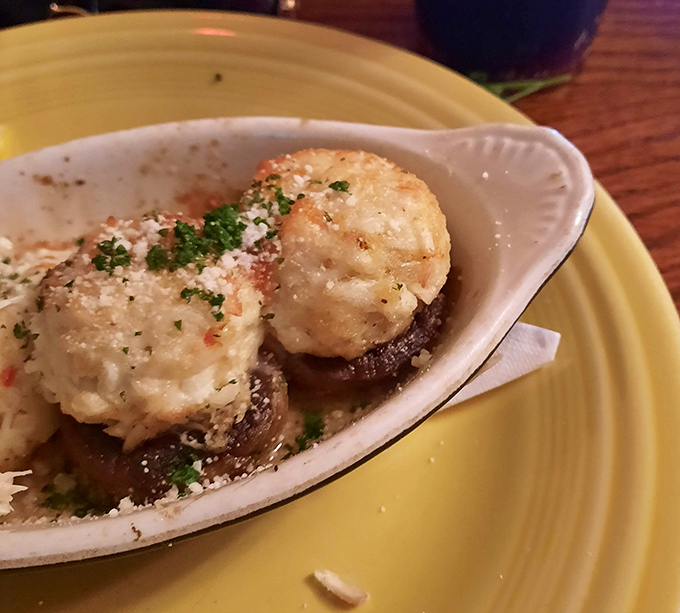 These aren't just stuffed mushrooms&mdash;they're little umami bombs of crab and cheese that might make you forget your table manners entirely.