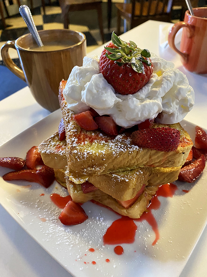 Not just French toast&mdash;it's a towering monument to morning indulgence. Strawberries, whipped cream, and powdered sugar create breakfast's answer to the Sistine Chapel.