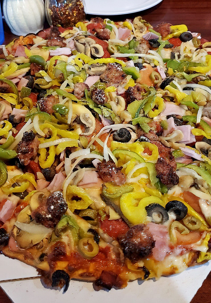 This isn't just a supreme pizza; it's a colorful canvas where every vegetable and meat performs in perfect harmony. Michelangelo would be jealous.