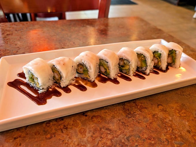 These pristine sushi rolls, artfully drizzled with sauce, prove that sometimes the most beautiful things in life come in eight perfect pieces.
