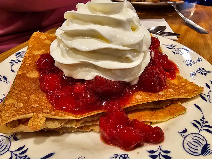Thin, delicate pancakes swimming in tart lingonberry sauce and crowned with a cloud of whipped cream. Dessert masquerading as breakfast? Absolutely.