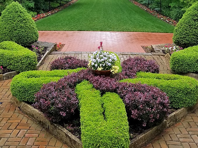 Garden geometry at its finest&mdash;these precisely trimmed hedges and colorful plantings prove that sometimes nature looks best when given a little artistic direction.