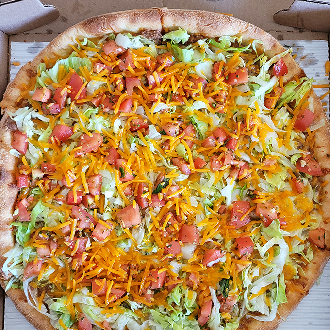Behold the taco pizza masterpiece &ndash; where Italian tradition meets Tex-Mex flair in perfect, colorful harmony.