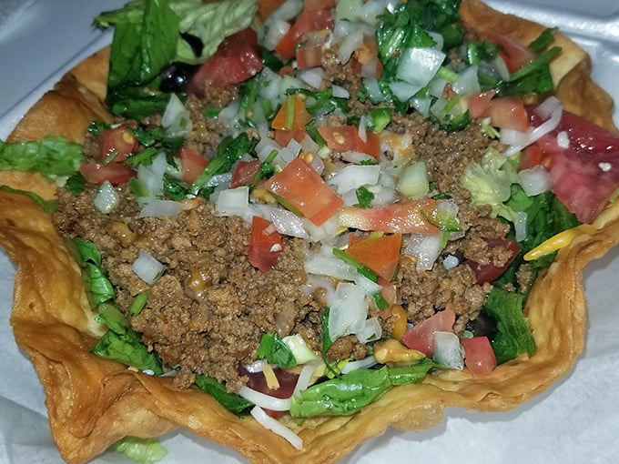 The legendary taco salad in all its glory&mdash;a crispy fortress cradling perfectly seasoned beef, fresh veggies, and enough cheese to make Wisconsin proud.