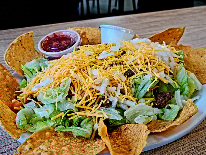 This taco salad doesn't just land on your table—it arrives with a perfect balance of crispy, cheesy, and fresh that would make any food critic salute.