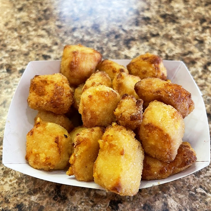 Golden-brown tater tot perfection that makes you question why you ever wasted time on lesser potato products. Each bite is a crispy revelation.