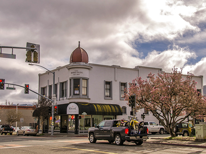 The Marks Building's distinctive dome and classic architecture anchor a downtown intersection, reminiscent of when small-town bank buildings were designed to impress rather than blend in.