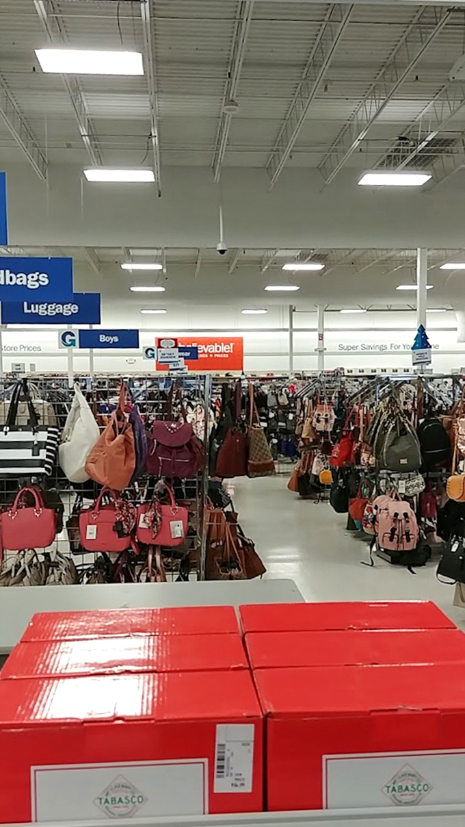 Handbag heaven awaits! Designer purses in every color imaginable hang like ripe fruit, ready to be plucked by fashion-forward bargain hunters.