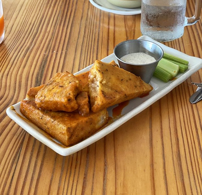 These golden-brown buffalo tofu triangles aren't "good for vegan food"&mdash;they're just plain good food. The perfect marriage of crispy exterior and tender interior that would make any wing joint nervous.