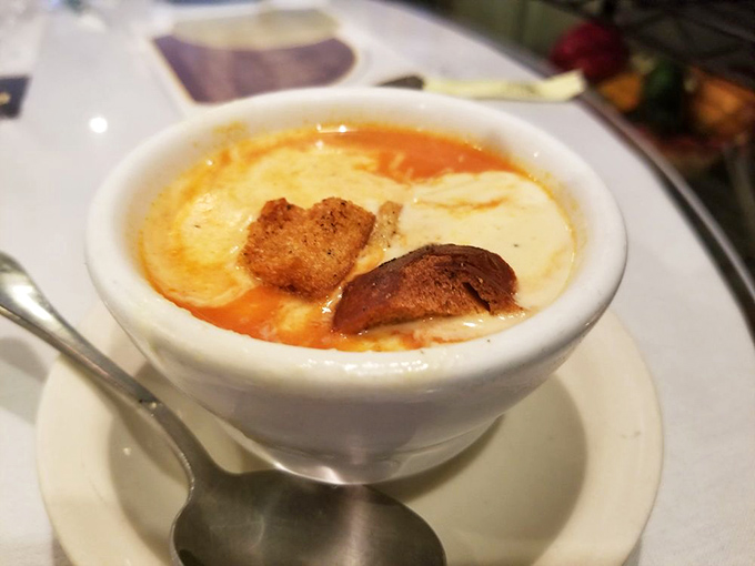 This isn't just tomato soup—it's a bowl of liquid sunshine topped with croutons that crunch like the perfect vinyl record drop.