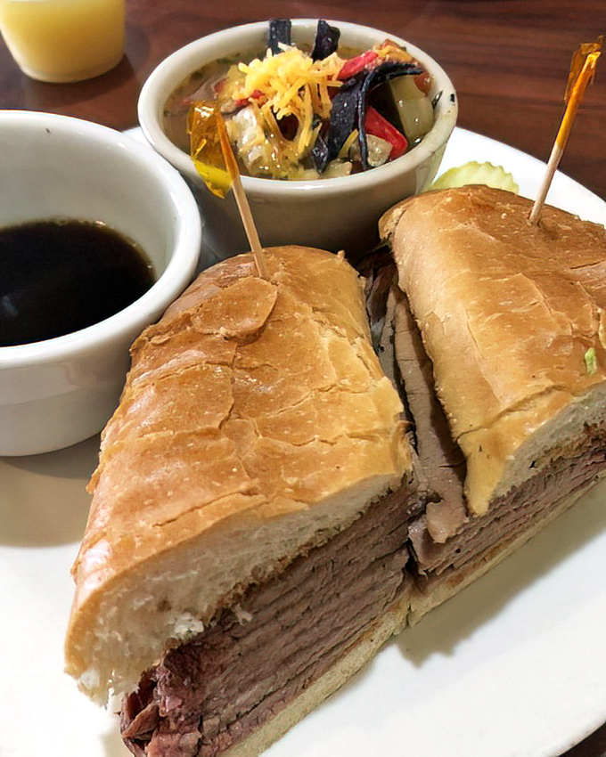 The legendary tri-tip sandwich in all its glory. Layers of perfectly roasted beef with au jus for dipping&mdash;this isn't just a sandwich, it's architecture with flavor.