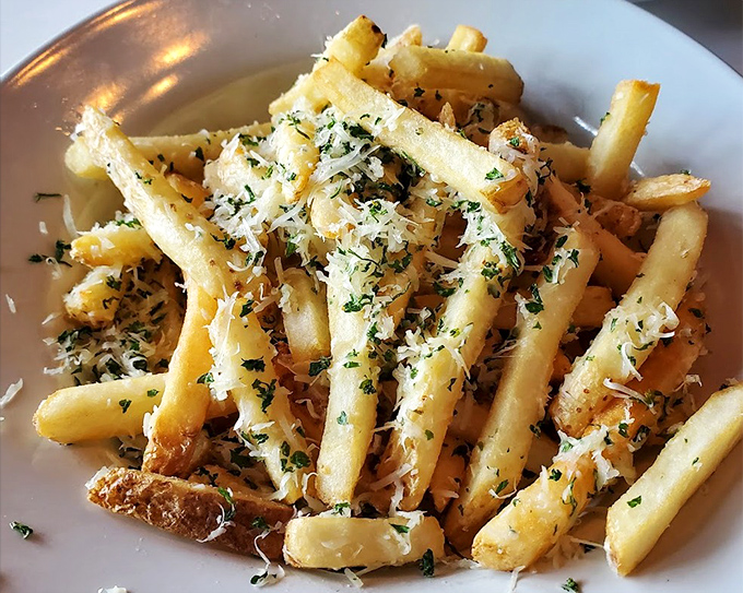 Golden, crispy truffle fries that make you pause mid-conversation. The parmesan and herbs aren't just toppings&mdash;they're a declaration of potato perfection.