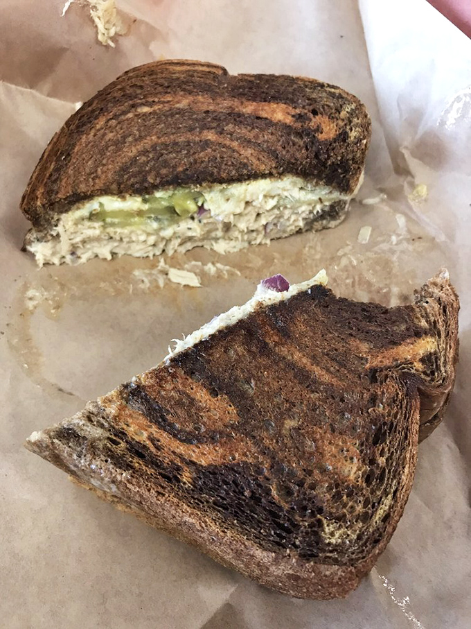 The legendary tuna melt in all its glory—perfectly toasted bread embracing that creamy tuna filling. This isn't your school cafeteria's sad sandwich.