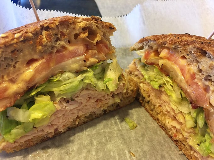 This turkey sandwich isn't just stacked—it's architecturally sound, with layers that complement each other like a well-rehearsed jazz quartet.