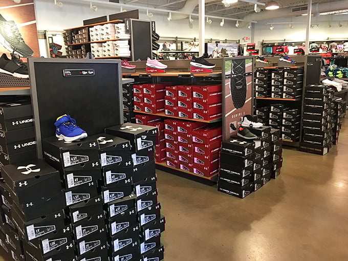 Sneaker heaven awaits at the athletic footwear section, where boxes stack like a monument to the gods of "just do it" at prices that say "yes, you can."