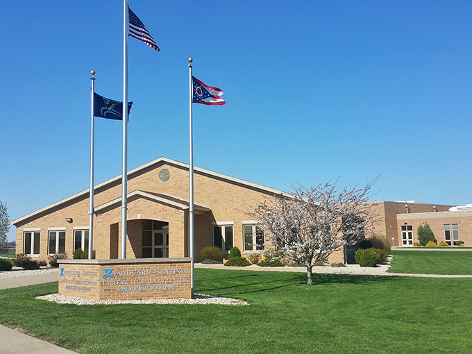 Small-town civic pride on full display with flags flying high outside this municipal building, where community decisions shape Fremont's affordable future.