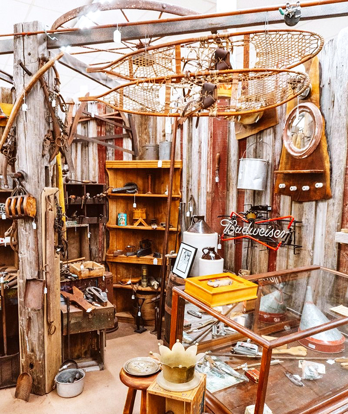 This rustic booth feels like stepping into an old fishing cabin, complete with vintage snowshoes overhead and enough Budweiser memorabilia to make the Clydesdales proud.