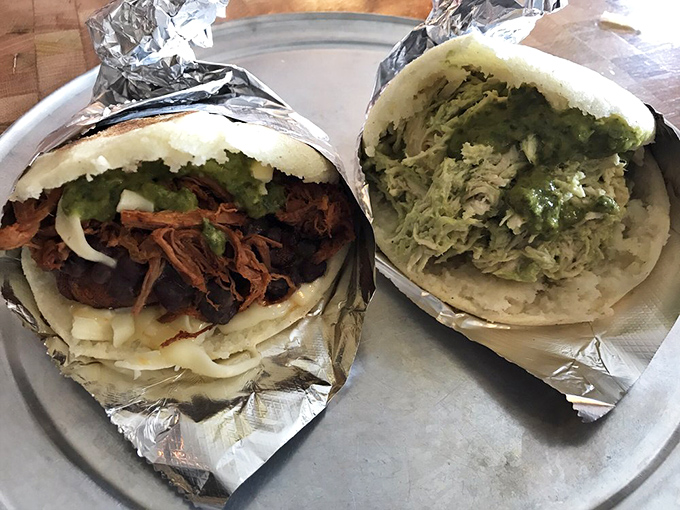 These Venezuelan arepas aren't just sandwiches; they're edible treasure chests filled with flavor combinations that'll make you question all your previous life choices.