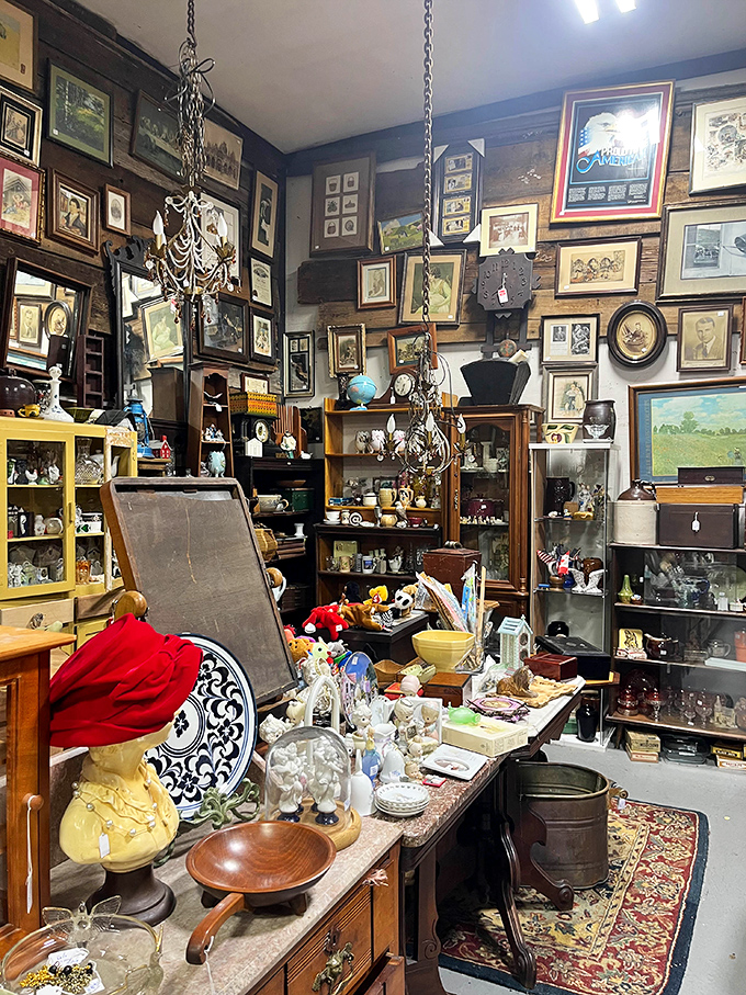 Wall-to-wall memories hang in this booth, where vintage frames create a time-travel portal to decades past. Chandeliers included, nostalgia extra.