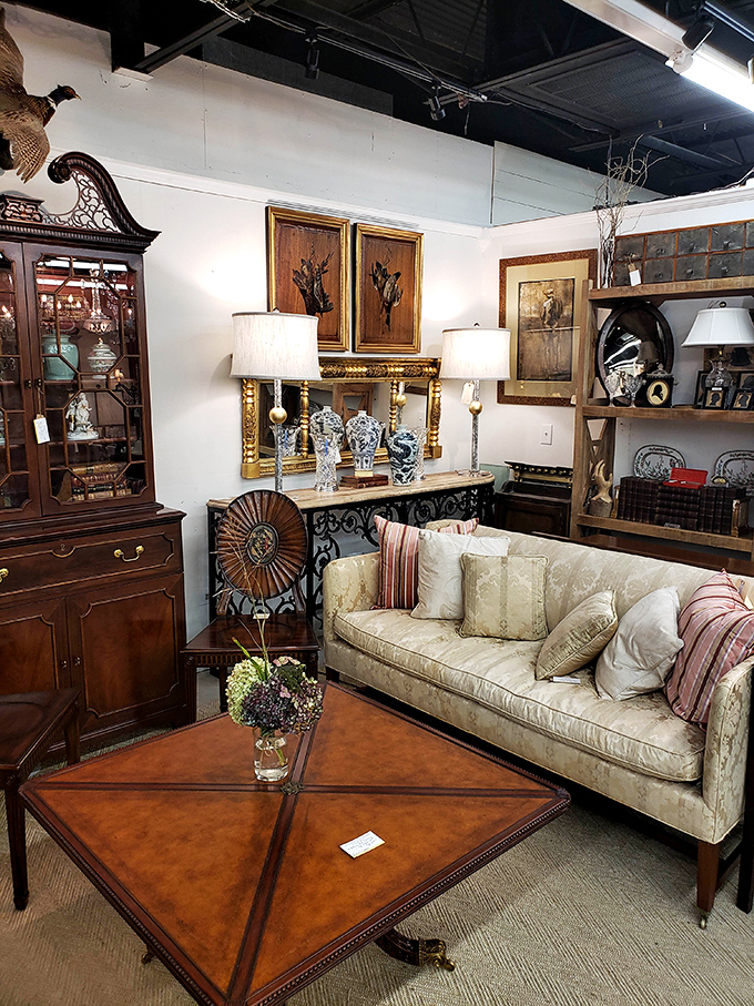 A living room setup that whispers "sit down and stay awhile" &ndash; though that coffee table has probably seen more fascinating guests than your dinner parties. 