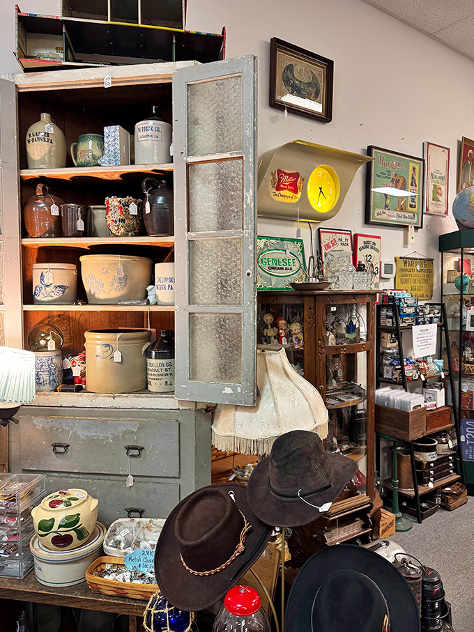 This isn't just furniture &ndash; it's time travel. Vintage cabinets displaying Pennsylvania pottery, antique crocks, and cowboy hats that have seen more adventures than most of us.