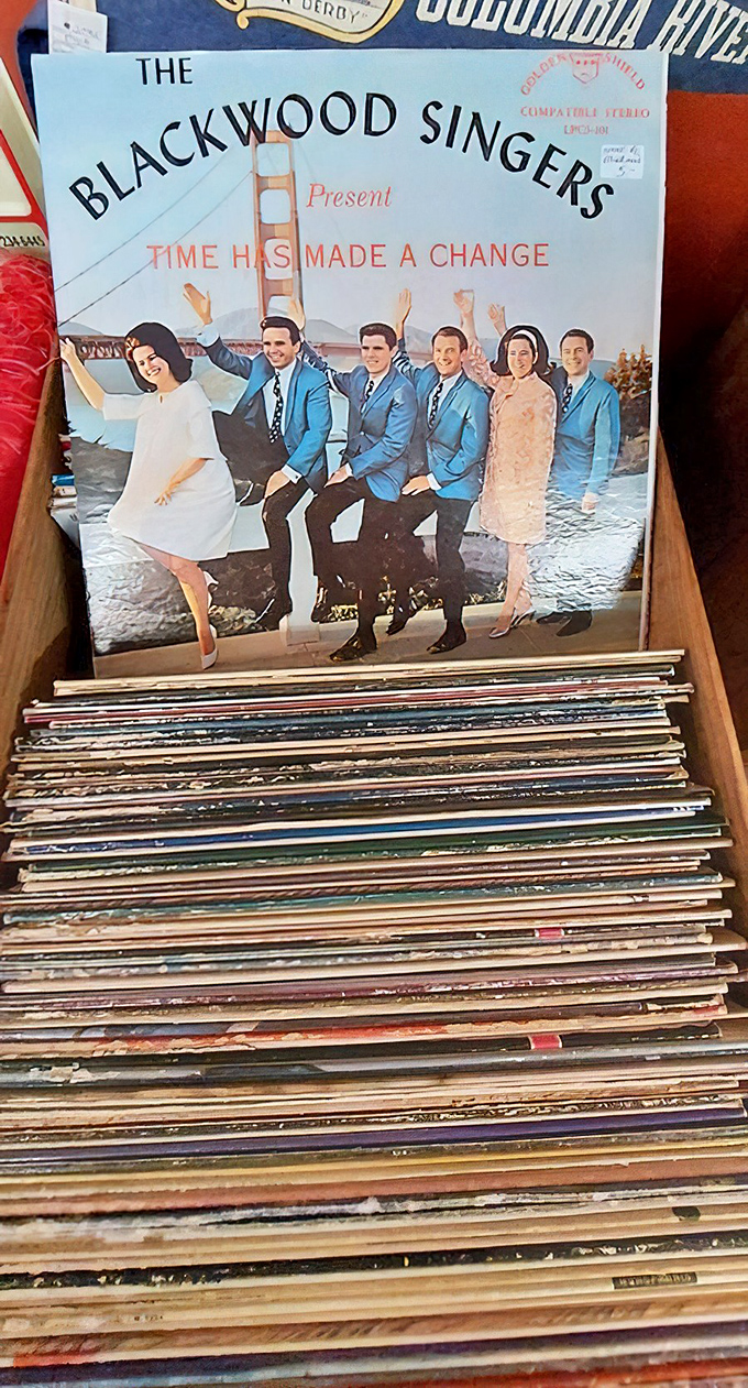 Vinyl treasures await the patient digger. The Blackwood Singers' album sits atop a mountain of musical history, each record a time capsule of someone's soundtrack.