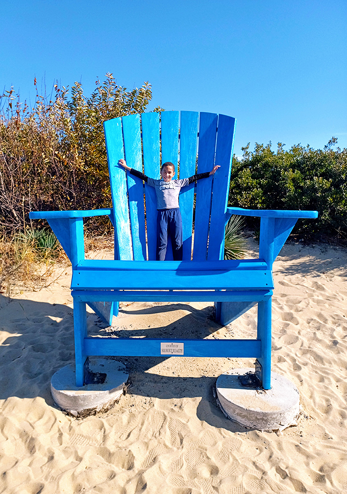 The iconic blue Adirondack chair &ndash; where beach memories are made and Instagram posts are born. Bigger than life, just like your vacation stories.