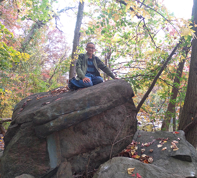 Finding your perfect thinking spot is an essential life skill. This sun-dappled boulder offers both perspective and a moment of zen.